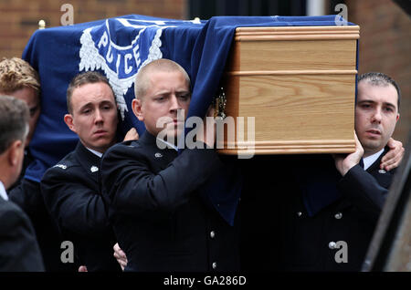 The coffin of murdered Policeman Pc Jon Henry leaves Holy Ghost ...