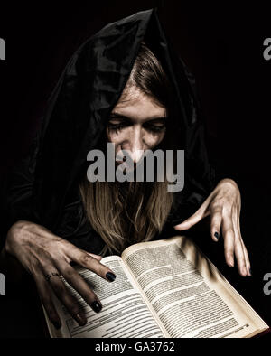 The evil witch casts a spell on pumpkins. Portrait of a woman in a ...
