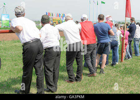People watching a sporting event horse racing as spectators Stock Photo ...