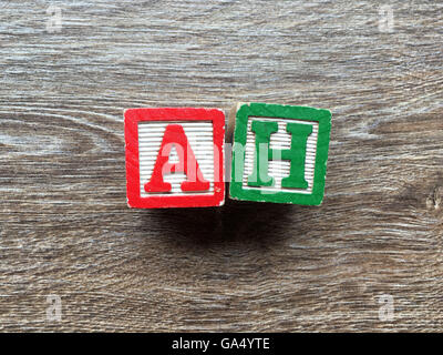 AH word text done with wood blocks letters Stock Photo - Alamy
