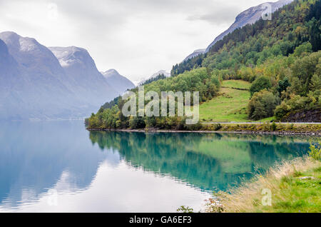 Reflection in Norway fjord at fall time Stock Photo - Alamy