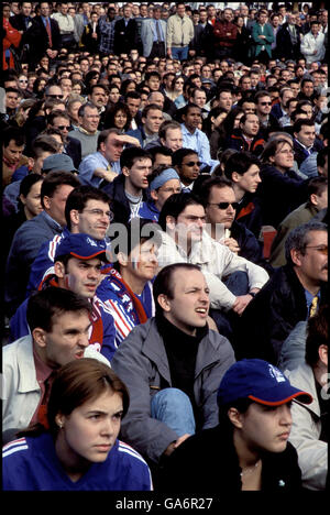 Soccer fans watch the game on their phones while Canada plays Qatar in ...