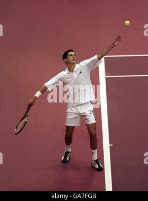 Tim Henman of Great Britain serves to Victor Hanescu of Romania Stock ...