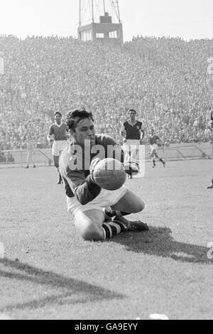 (L-R) Aston Villa goalkeeper Nigel Sims punches clear from West ...
