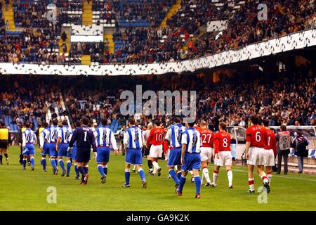 The teams walk out on to the pitch ahead of the UEFA Champions League ...