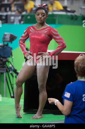 Simone Biles talks to a coach during warm ups before the start of the U ...