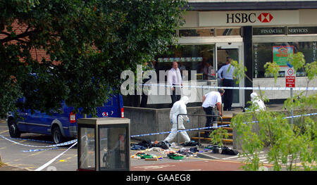 Police at the scene where two robbers were shot dead at an HSBC bank at ...