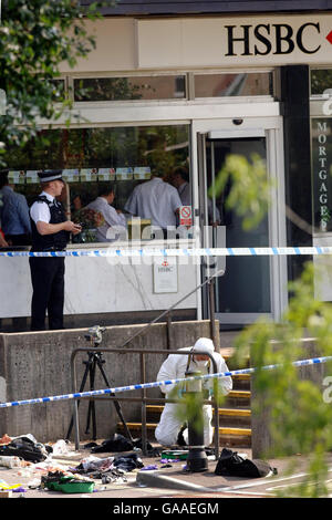 Robber shot dead during bank raid Stock Photo - Alamy