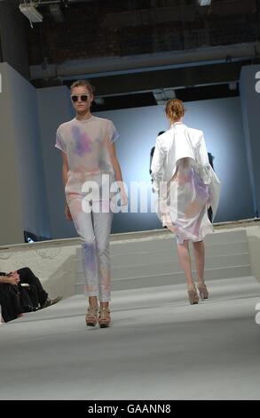 A model wears a creation by designers Richard Nichols during London ...