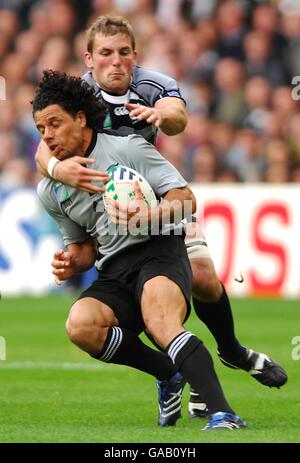 Doug Howlett of New Zealand is tackled by Scotland's Kelly Brown, left ...