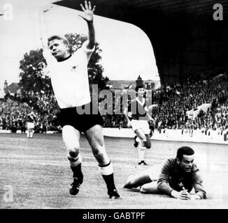 West Germany's Helmut Haller (second r) fires home the opening goal ...