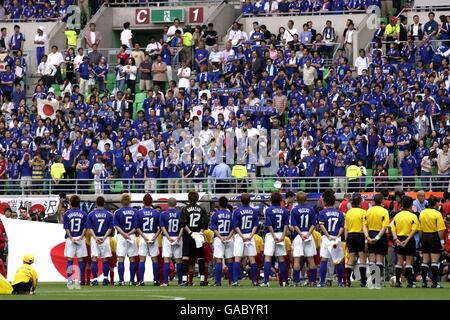 Players of Japan and Tunisia line up prior to their World Cup Group F ...