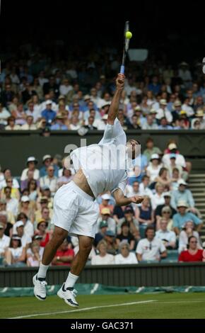 Tennis - Wimbledon 2002 - First Round. Tim Henman smashes a winner at ...