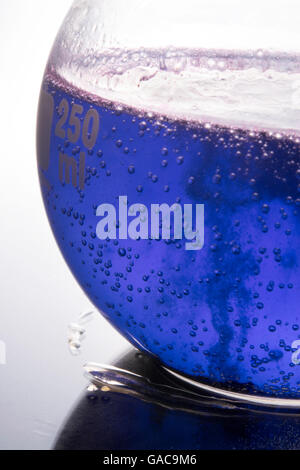 Water boiling in lab flask over bunsen burner Stock Photo - Alamy