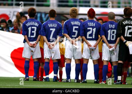 Players of Japan and Tunisia line up prior to their World Cup Group F ...