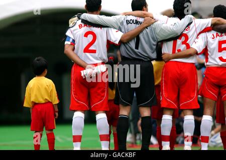 Players of Japan and Tunisia line up prior to their World Cup Group F ...