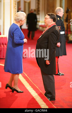 Mr. Timothy Workman is made a CBE by The Queen at Buckingham Palace ...