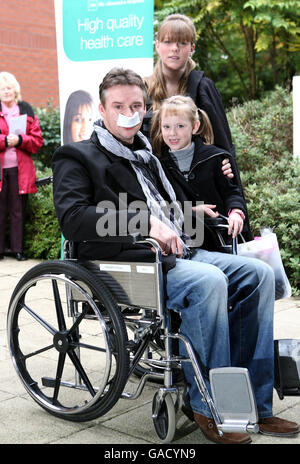 Russell Watson leaves the Alexandra Hospital Cheadle with his daughters ...
