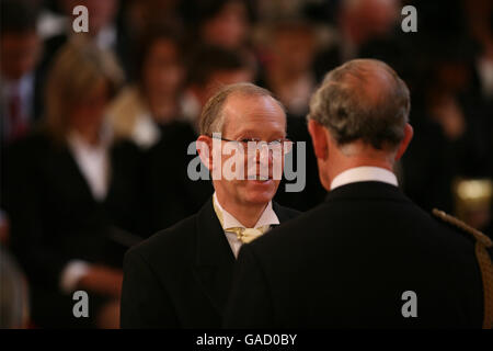 Dr. Malcolm Wakerley from Epsom is made an OBE by the Prince of Wales ...