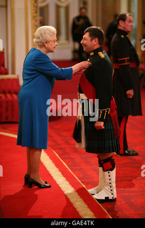 Major Gary McGown is made an MBE by The Queen at Buckingham Palace ...