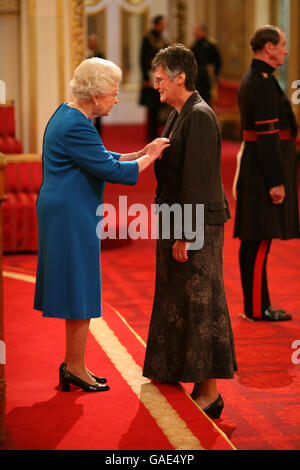 Mrs Catherine Hopkins is made an MBE by The Queen at Buckingham Palace ...