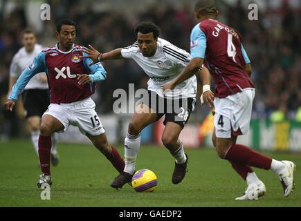 Derby County's Giles Barnes holds off Colchester United's Wayne Brown ...