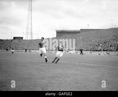 Birmingham City's Alex Govan (r) crosses the ball past Chelsea's Ian ...