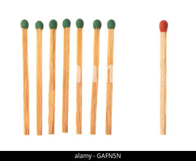 Set of seven red wooden matches and one green isolated on white ...