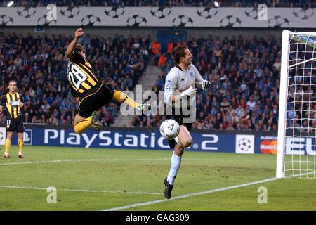 AEK Athens' Milen Petkov (l) shoots for goal under pressure from RC ...