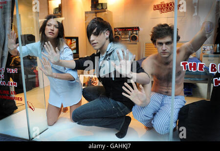 Pedestrians walk by models launching MTV's 'The Bedroom Diaries' - as ...