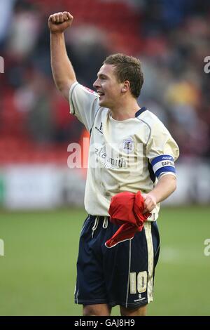 Barnsley's goalscorer Brian Howard celebrates with his team mates ...