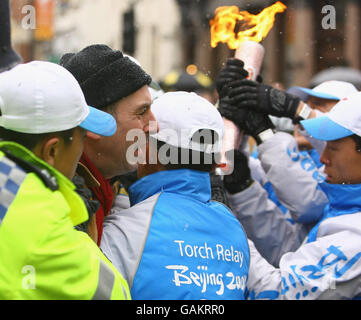 Security officers intervene as a demonstrator grabs and attemps to take ...