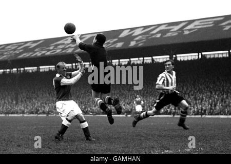 (L-R) Plymouth Argyle's George Dews protects himself as Brentford ...