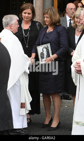 The funeral of journalist Terry Keane, as mourners carry her coffin ...