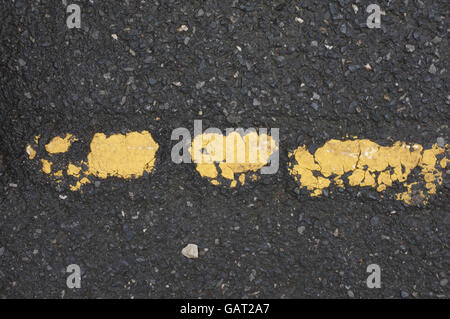 Pale yellow line on the road Stock Photo - Alamy