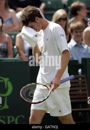 Great Britain's Andy Murray wipes sweat away from his eyes during his ...