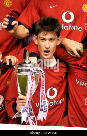 Manchester United' captain David Jones lifts the FA Youth cup trophy ...