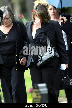 Lyn Philcox (centre) attends the funeral of her children, Amy and Owen ...
