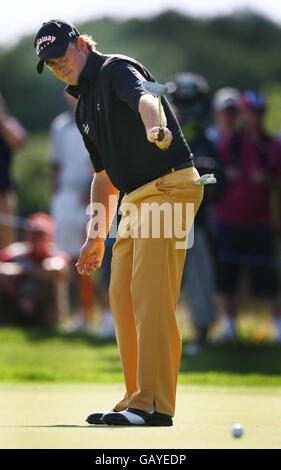 Graeme McDowell, of Northern Ireland, watches his putt on the 16th hole ...