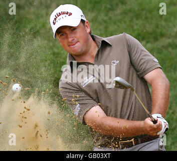 Graeme McDowell from Northern Ireland hits his tee shot on the 4th hole ...