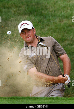 Graeme McDowell, of Northern Ireland, watches his putt on the 16th hole ...