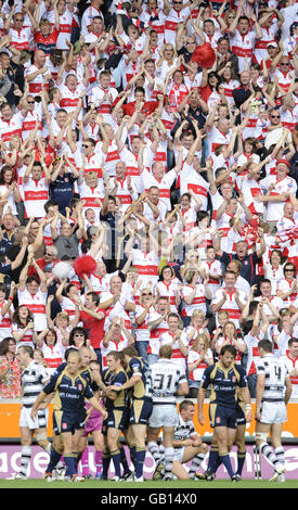 Hull FC players celebrate with the fans after scoring a try during the ...