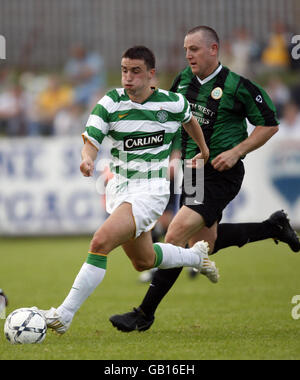 Glasgow Celtic soccer players run during their light training in the ...