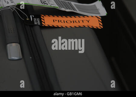 A British Airways priority baggage label and First Class label on a ...