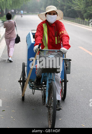 A man wears a face mask as he walks past the Old Opera in Frankfurt ...
