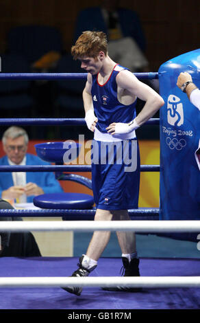 Great Britain's bantamweight boxer Joe Murray is hit on the head by a ...