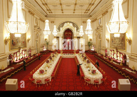 Staff members lay the State Banquet table, in the ballroom at ...