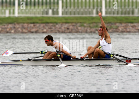 Great Britain's Mark Hunter and Zac Purchase (foreground) fall behind ...
