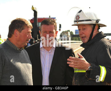 Northern Ireland Ministers Sammy Wilson (left) and Conor Murphy during ...