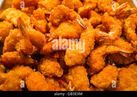 Large pile of popcorn shrimp tempura in buffet tray Stock Photo - Alamy
